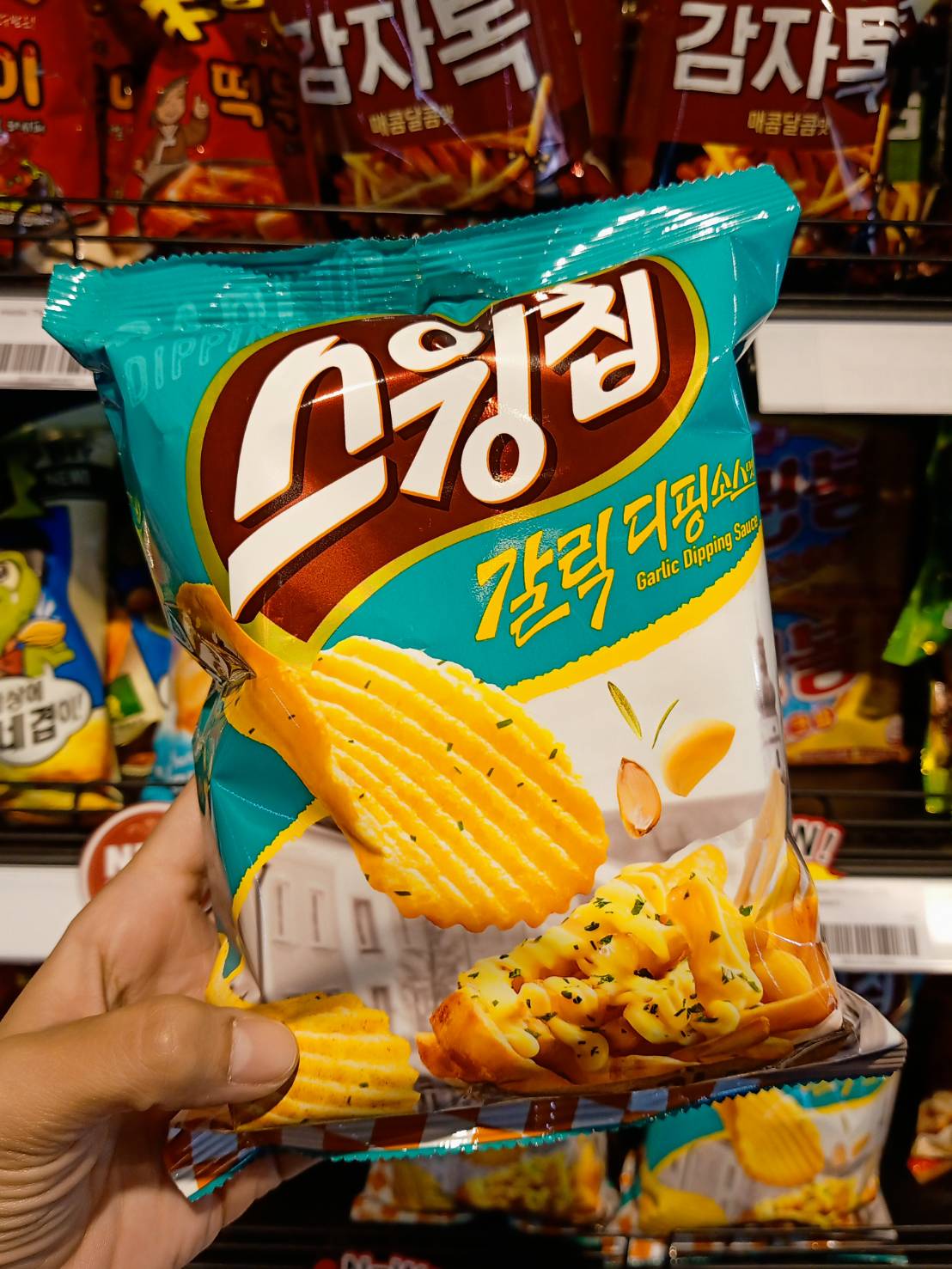 Orion Swing Chip Garlic Dripping Sauce ขนมมันฝรั่งเกาหลีรสกระเทียม 30 ...